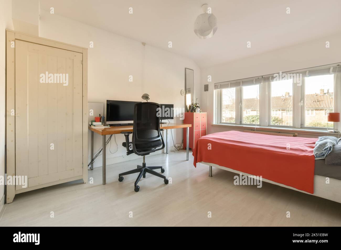 Interior of modern bedroom with comfortable bed and workspace with ...