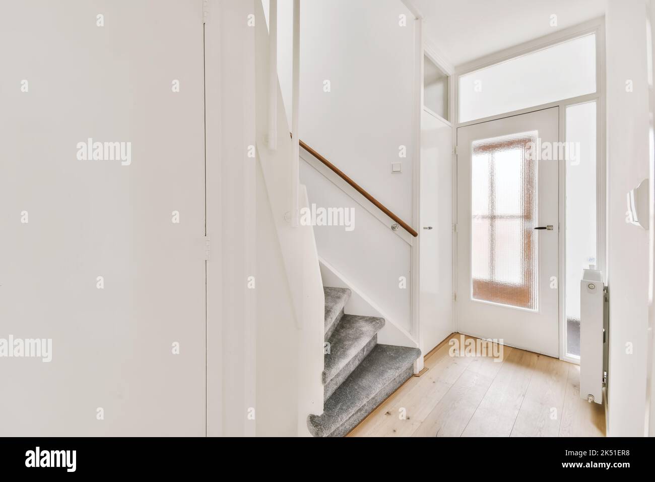 Interior passage way in bright modern house with parquet floor Stock ...