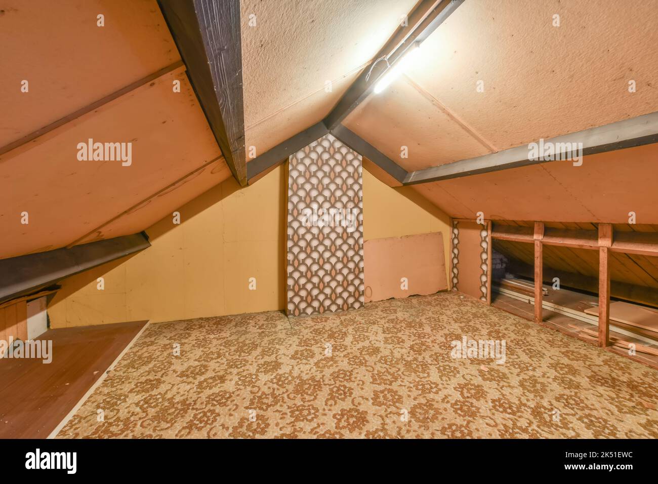 Interior of spacious vintage wooden attic room with wallpaper and ...