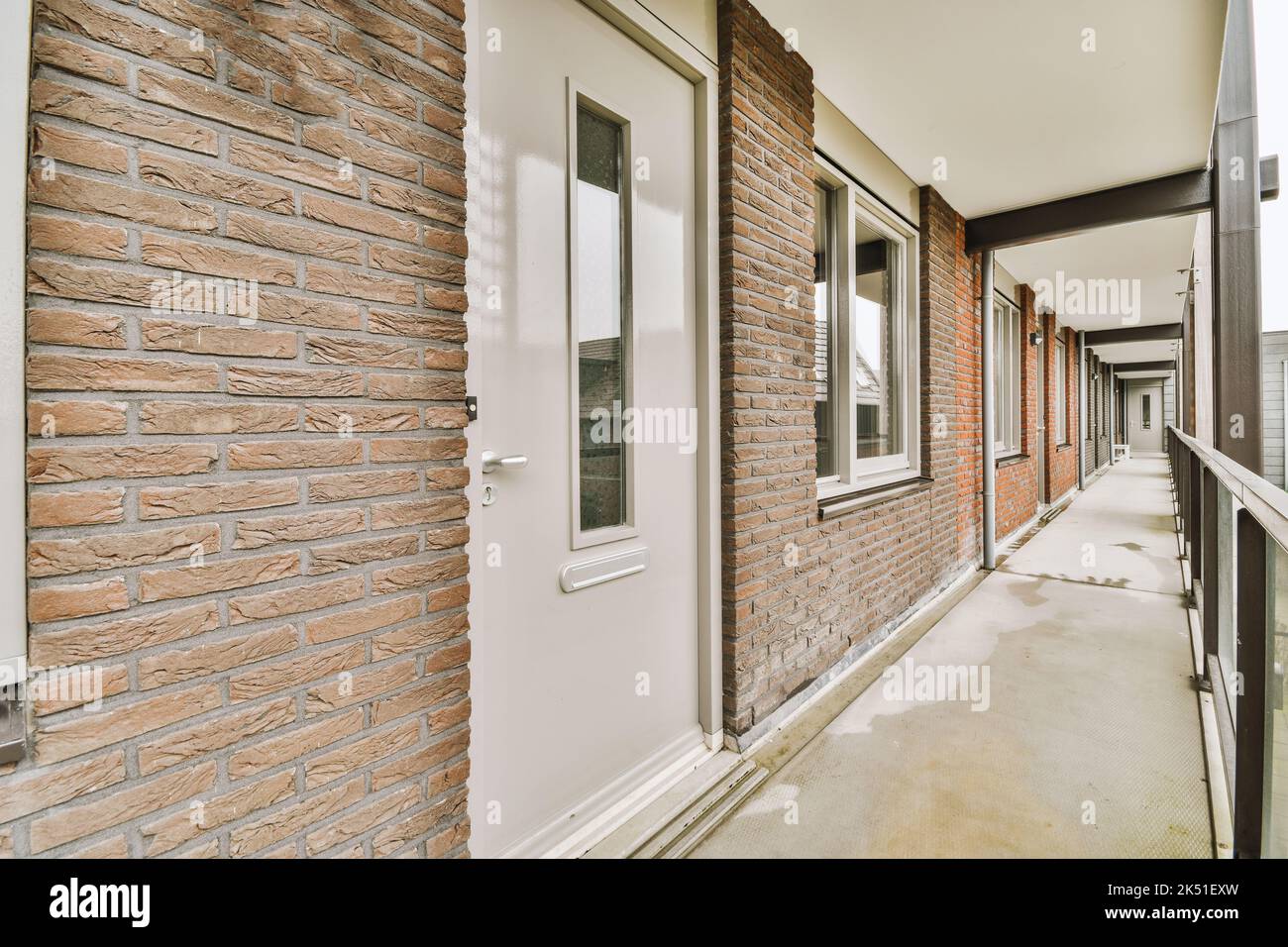 Long straight narrow passage of multistory residential apartment ...