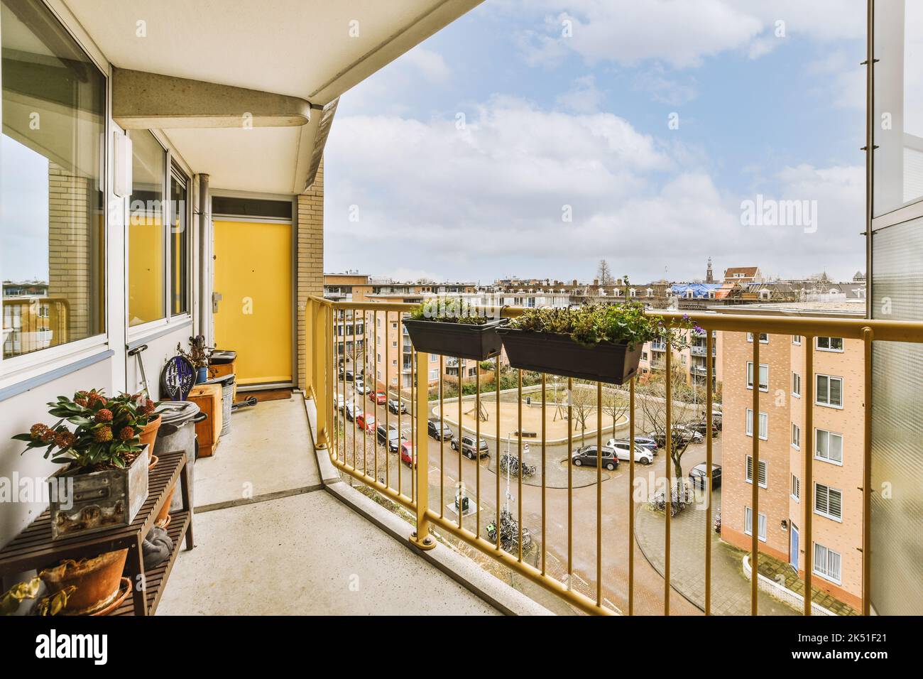 Balcony overlooking city with residential buildings and trees Stock ...