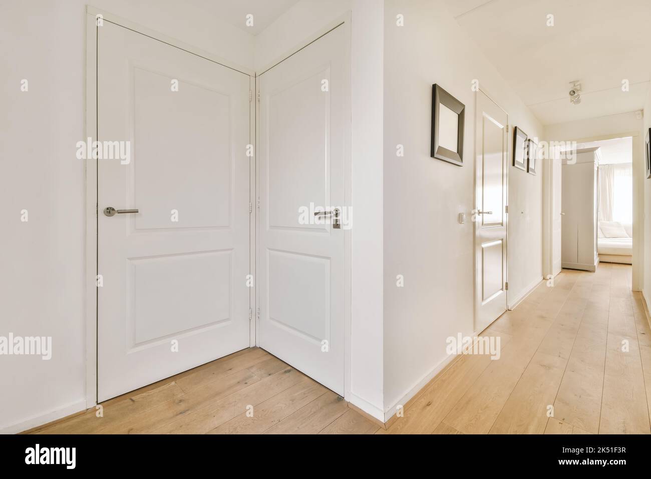 Interior passage way in bright modern house with parquet floor Stock ...