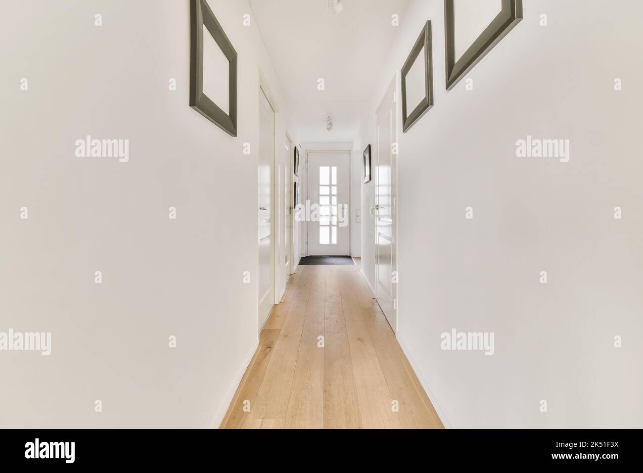 Interior passage way in bright modern house with parquet floor Stock ...