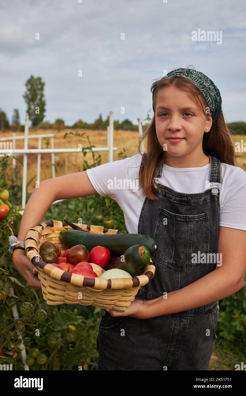 Farm girl overalls vegetables hi-res stock photography and images - Alamy