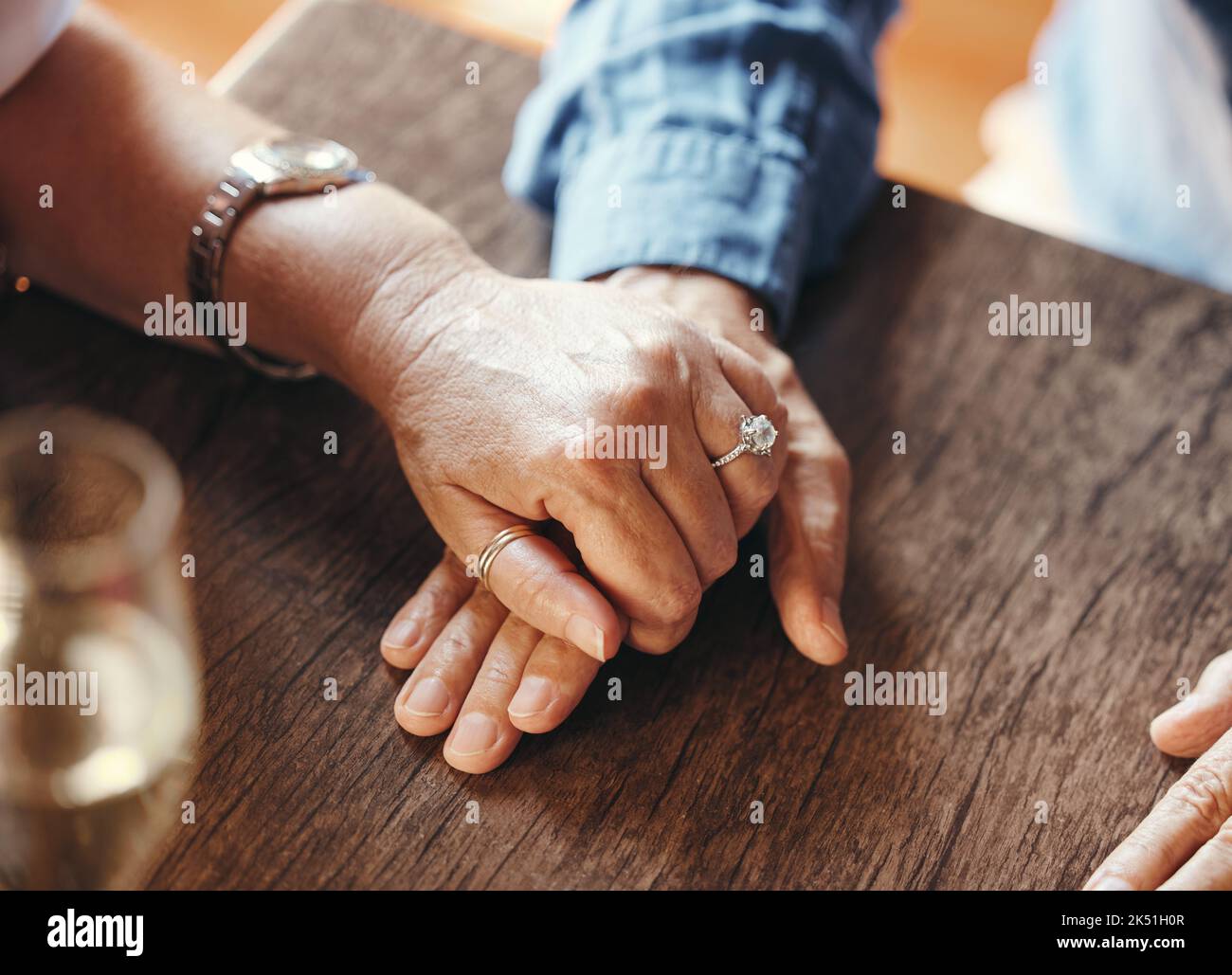 Holding hands, date and couple with support at restaurant for ...