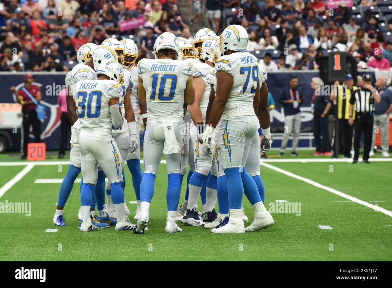 Los Angeles Chargers quarterback Justin Herbert (10) huddles the ...
