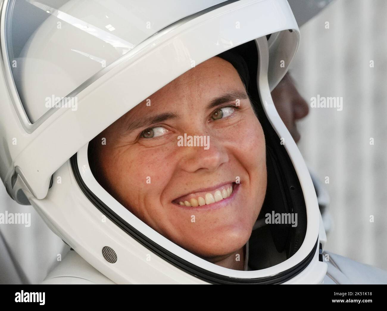 Russian cosmonaut Anna Kikina walks out with the rest of NASA's fifth ...