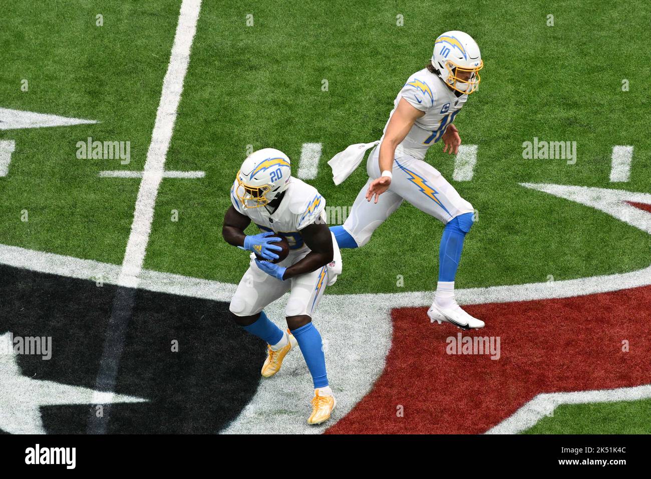 Los Angeles Chargers running back Sony Michel (20) takes a hand-off ... Los Angeles Chargers running back Sony Michel (20) takes a hand-off ...