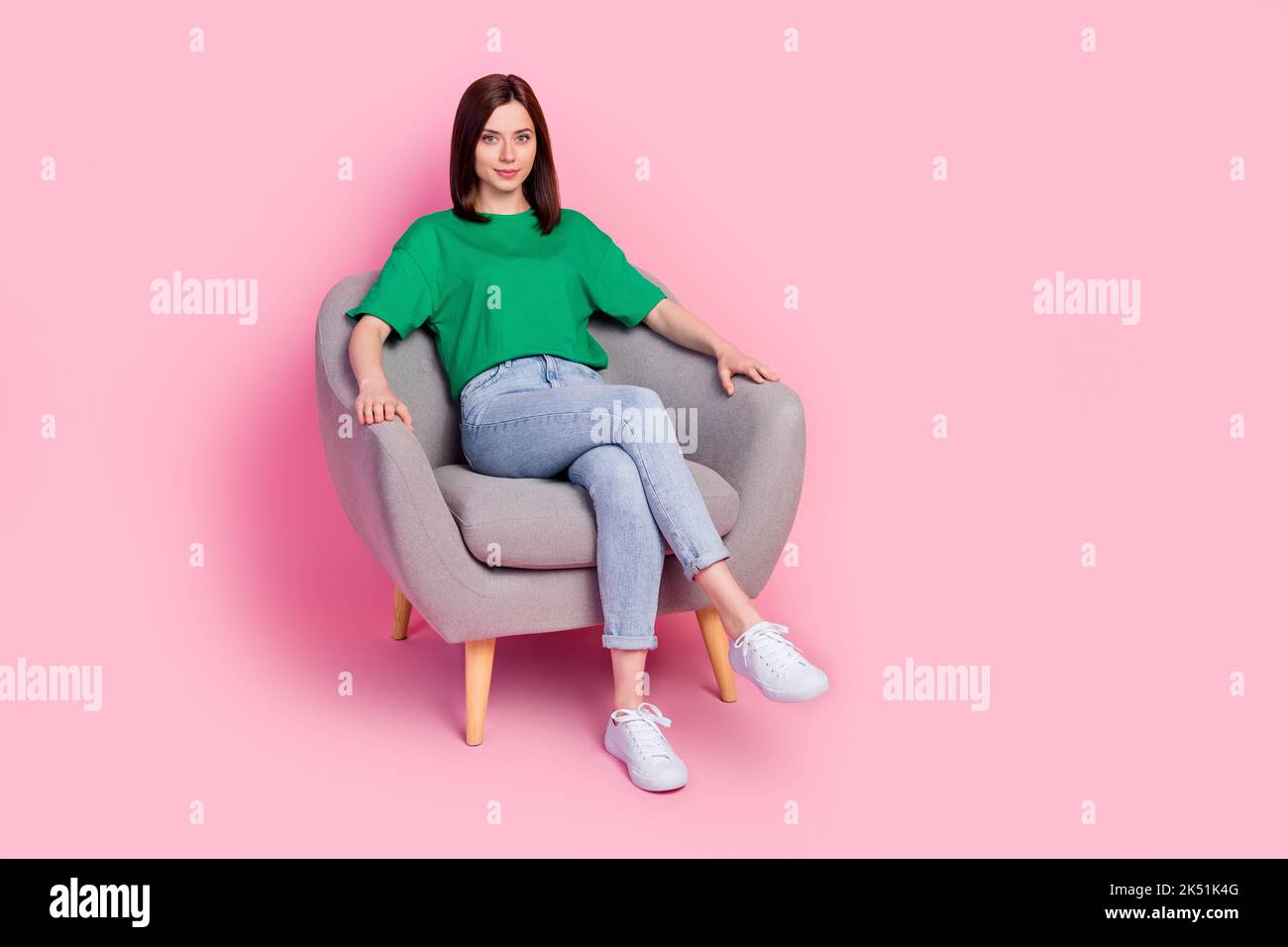 Full length photo of nice young person sit comfy chair isolated on pink ...