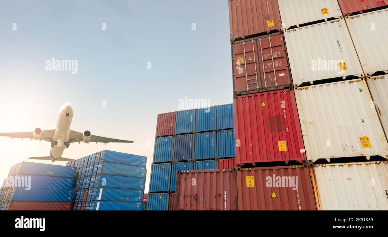 Air logistics. Cargo airplane flying above stack of logistic container ...