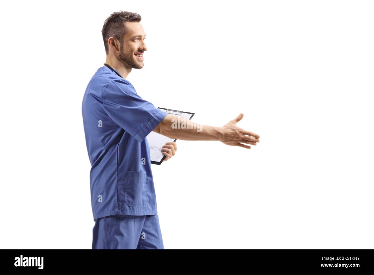 Young male health worker greeting with hand isolated on white ...