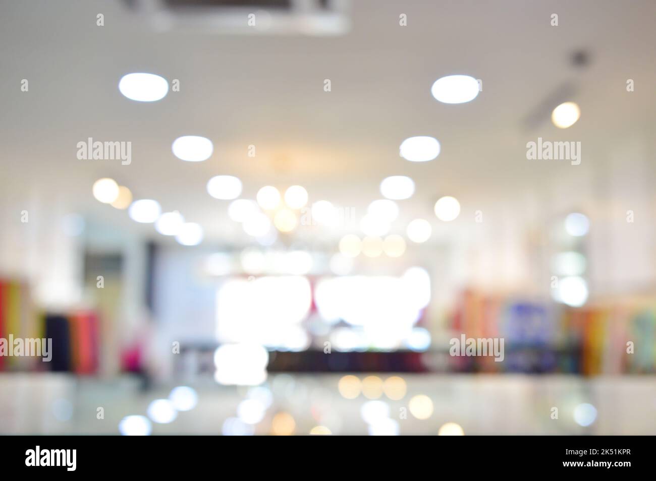 Abstract blurred entrance area of cloth store as background. Clothes ...