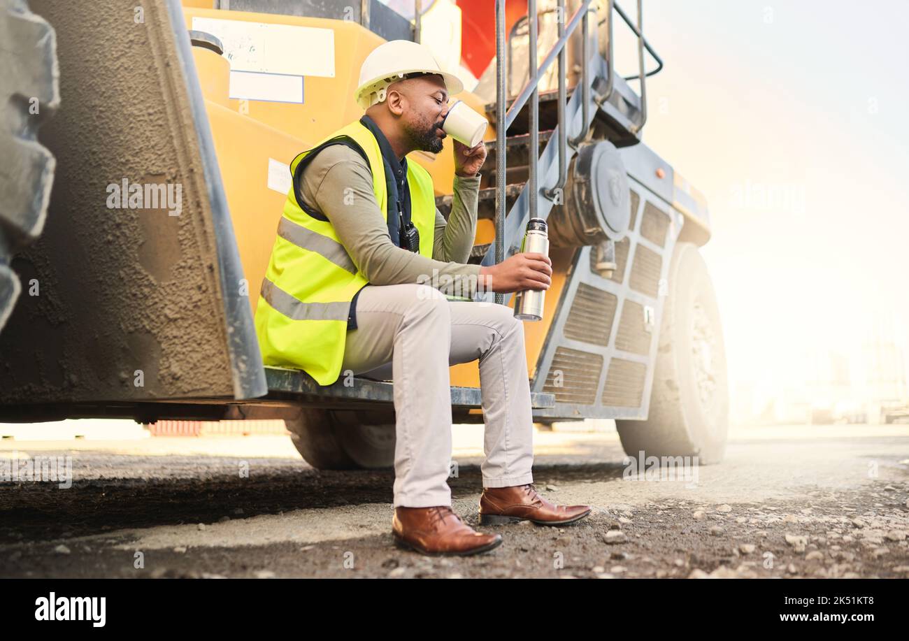 Coffee, construction and break with a building man holding a flask on a ...