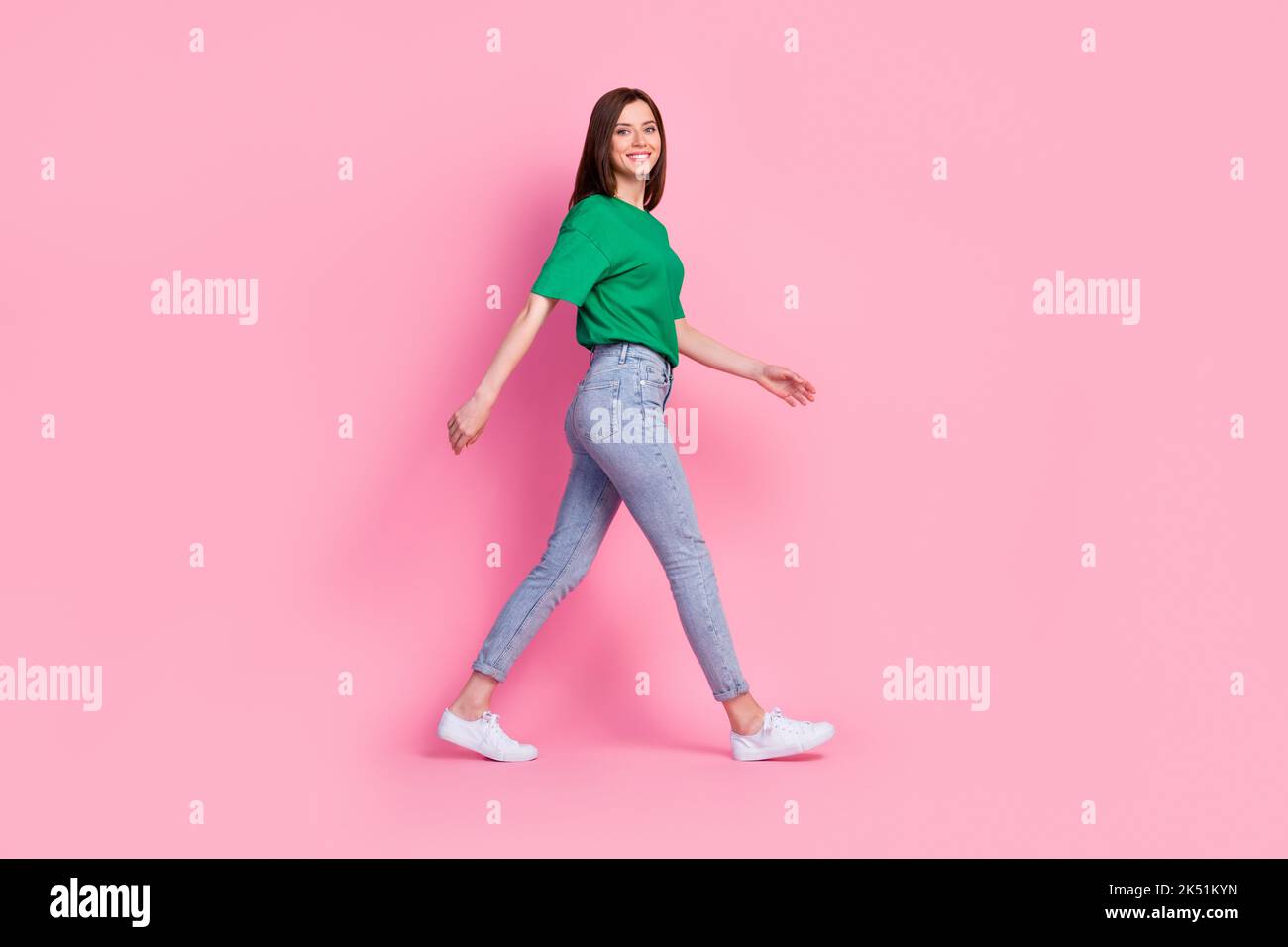 Full size photo of stunning young lady walking toothy beaming smile ...