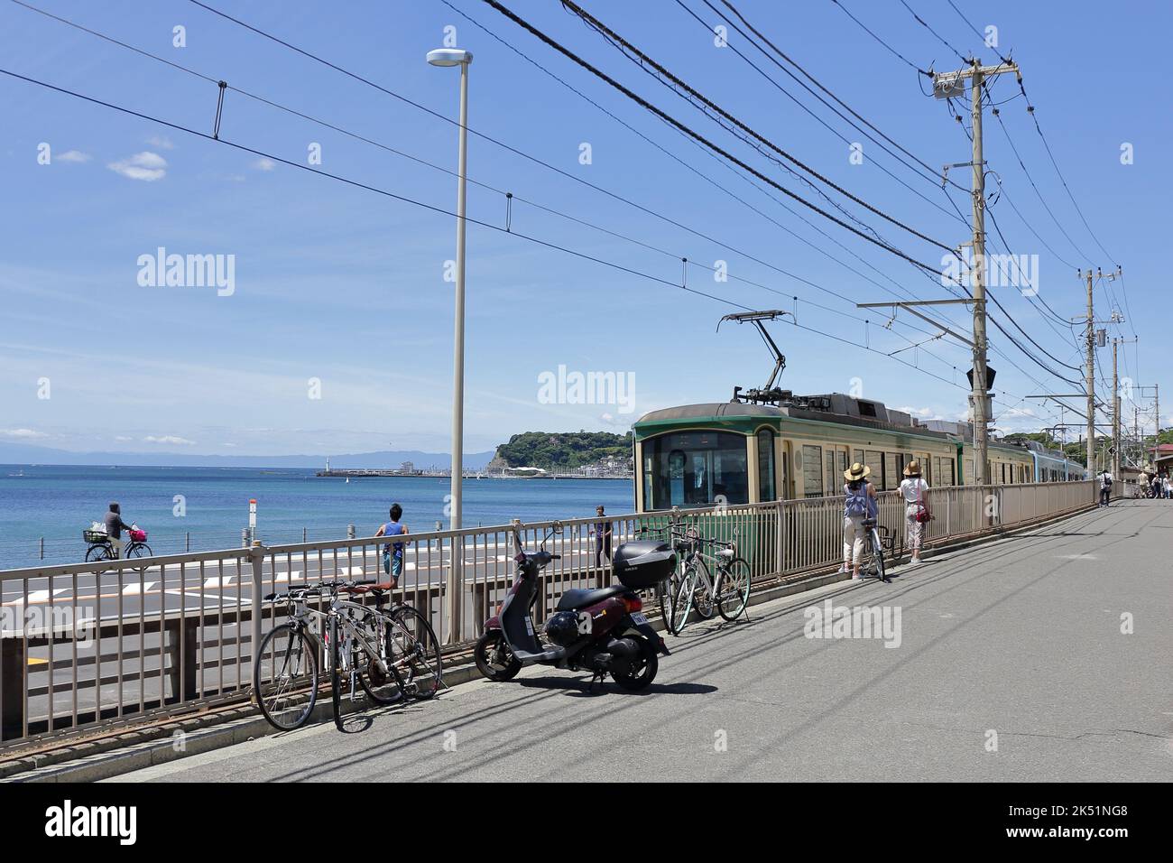 the train of Enoshima Electric Railway is passing the level crossing ...