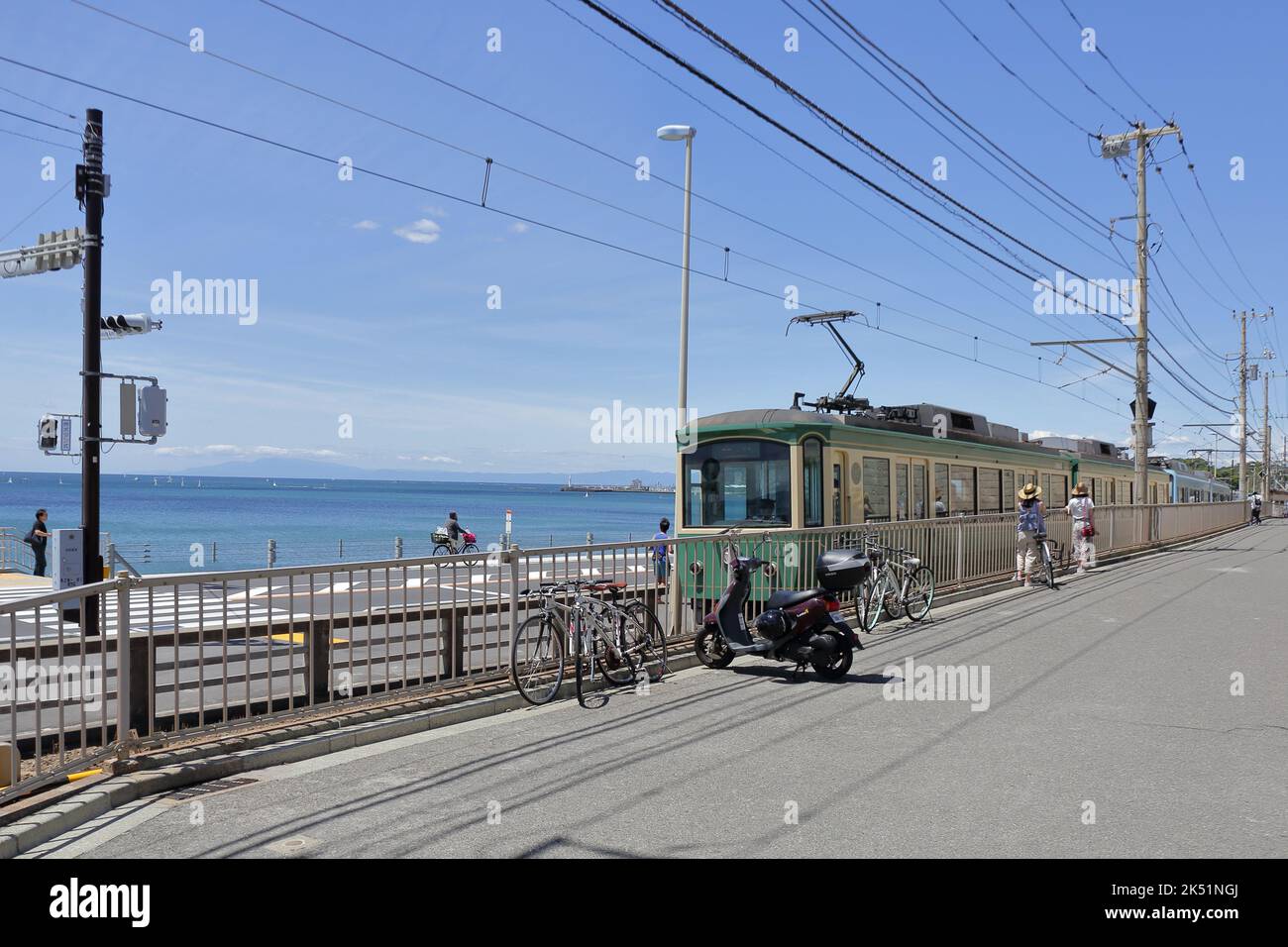 the train of Enoshima Electric Railway is passing the level crossing ...