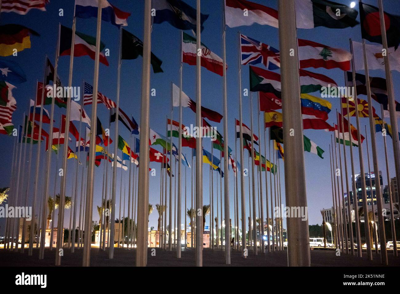 A visitor takes a photograph of 120 flags, from all countries ...