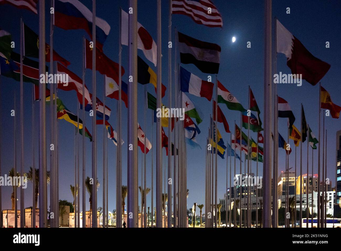 A visitor takes a photograph of 120 flags, from all countries ...