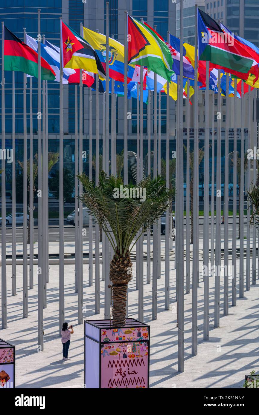 A visitor takes a photograph of 120 flags, from all countries ...
