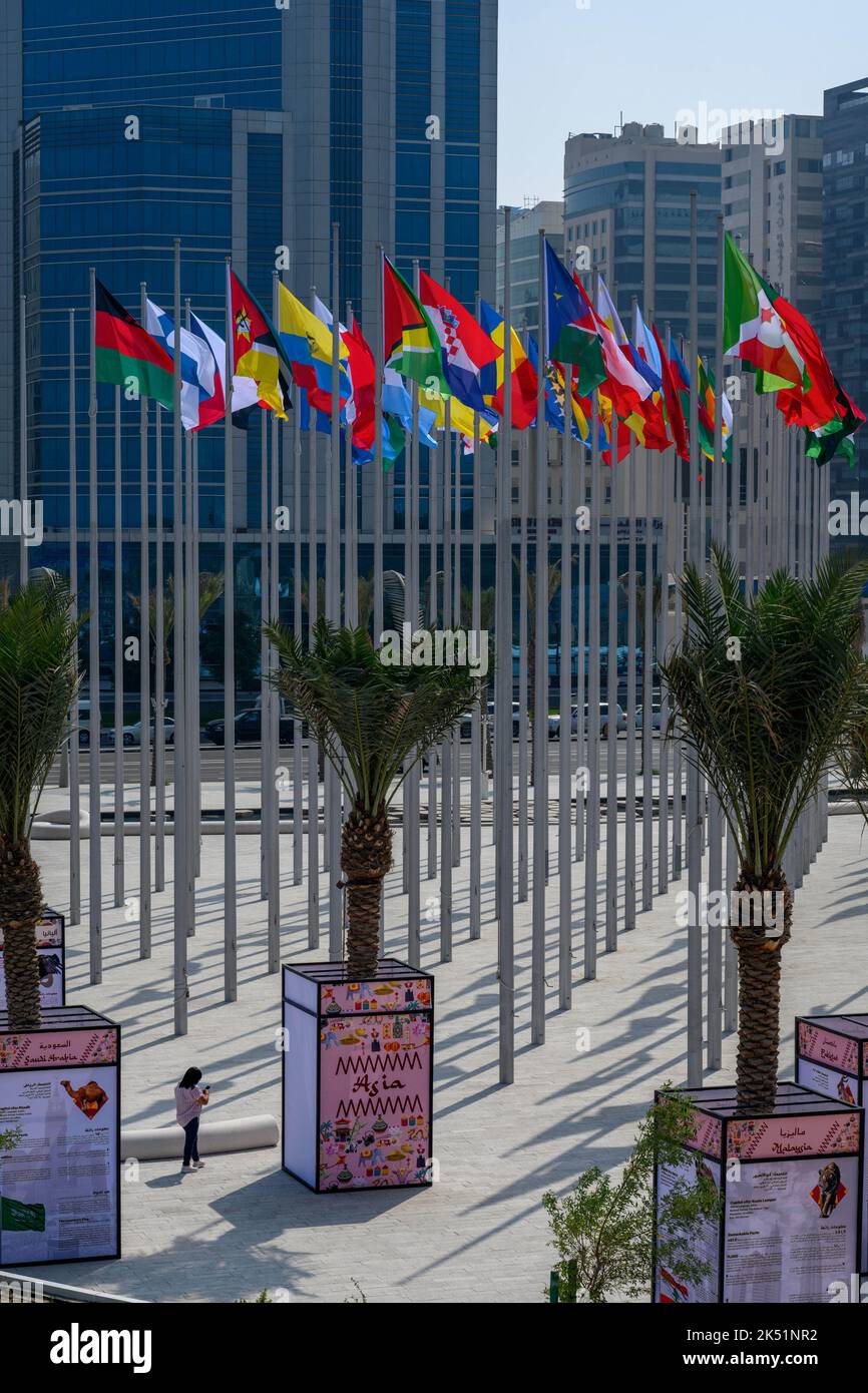 A visitor takes a photograph of 120 flags, from all countries ...