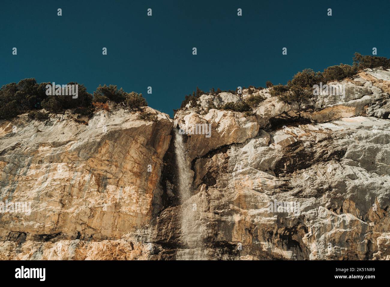 Alpine Waterfall in Fall Stock Photo - Alamy