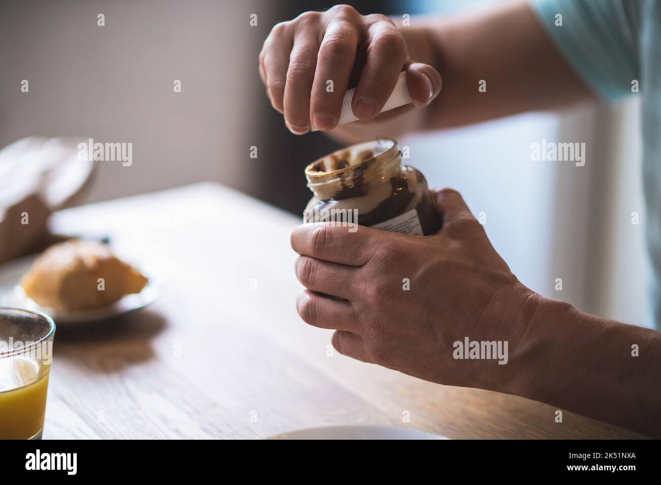 Close up picture of man breaking bread for sandwiches Stock Photo - Alamy