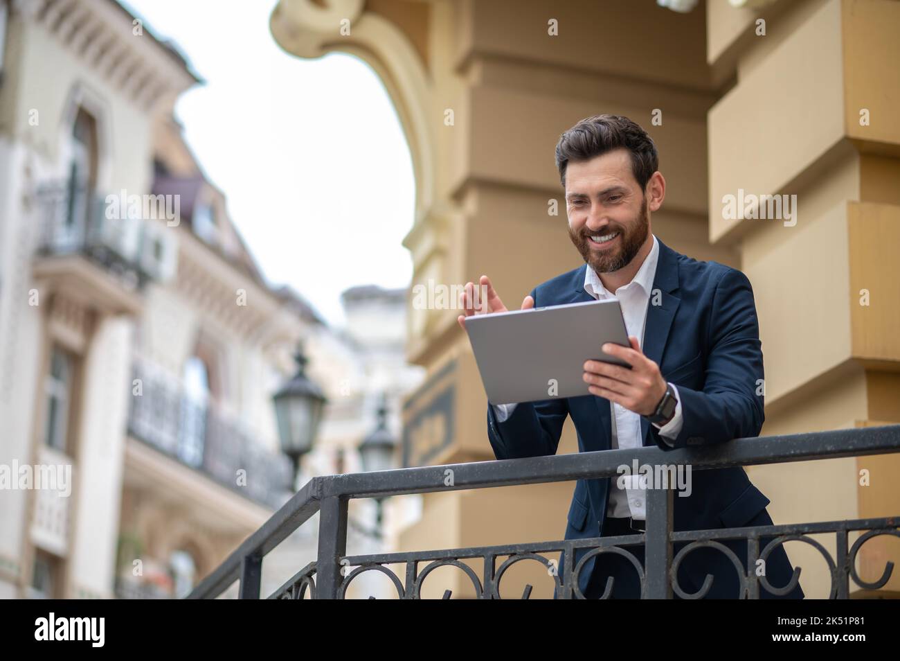 Good-looking young well-dressed businessman with a tablet Stock Photo ...