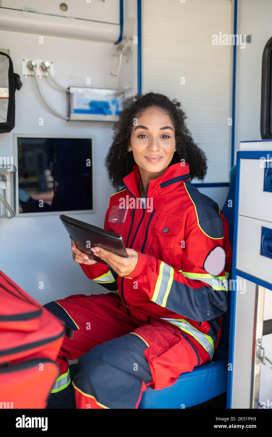 Female paramedic posing for the camera in the ambulance car Stock Photo ...