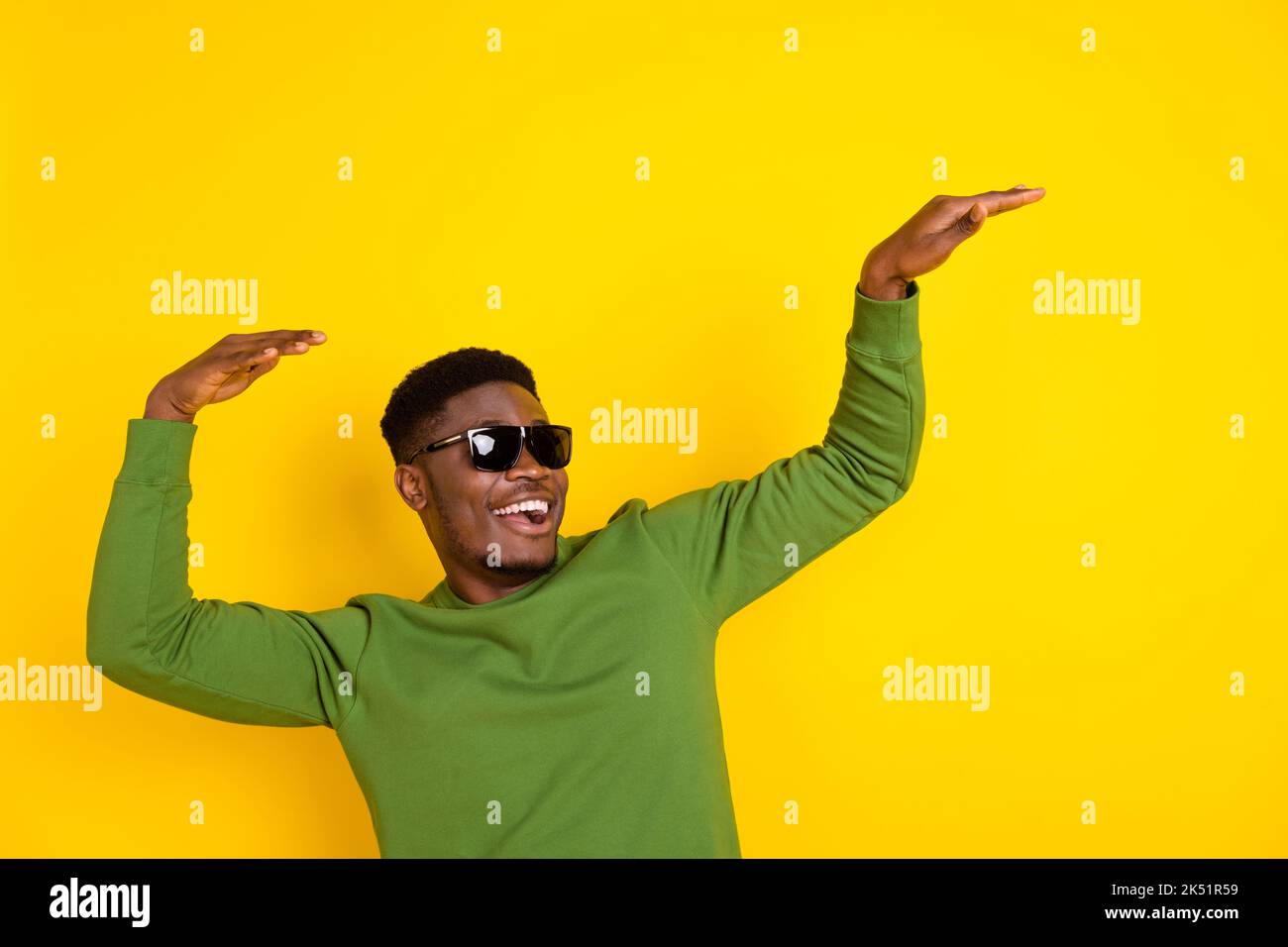 Portrait of attractive cheerful guy dancing moving having fun night ...