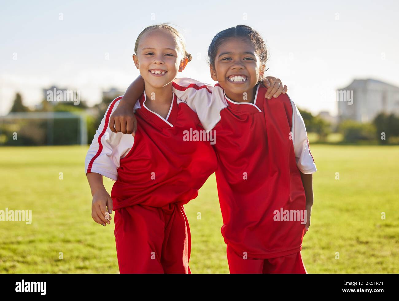 Portrait, girl friends and smile on football field training for match ...