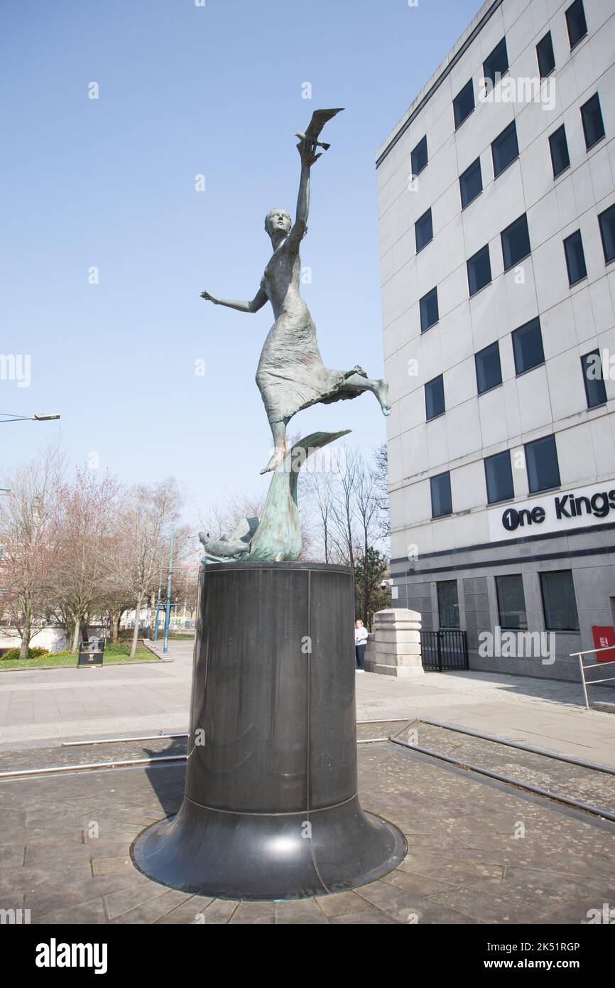 A statue of a woman and a bird at Kingsway, Cardiff, Wales in the UK ...