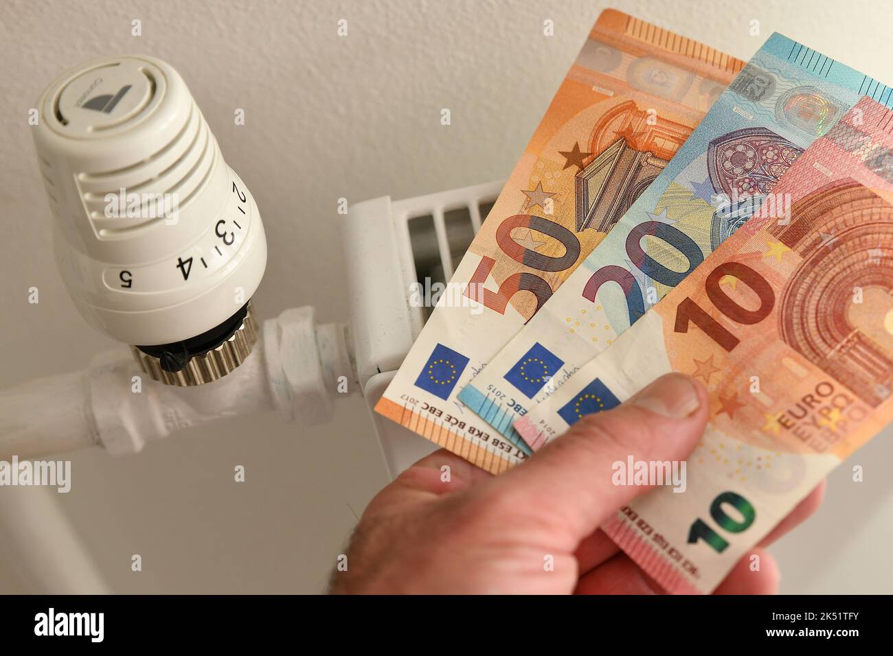 Illustration photo - a thermostat on a modern heating system in an ...