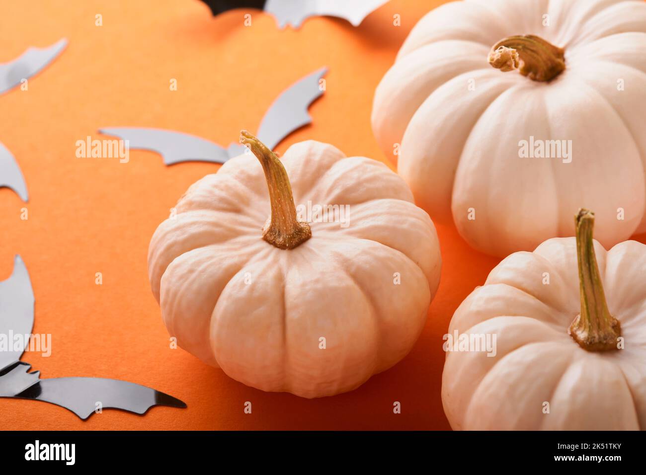 Halloween background. Flock of black bats, spider, pumpkin, and leaves ...