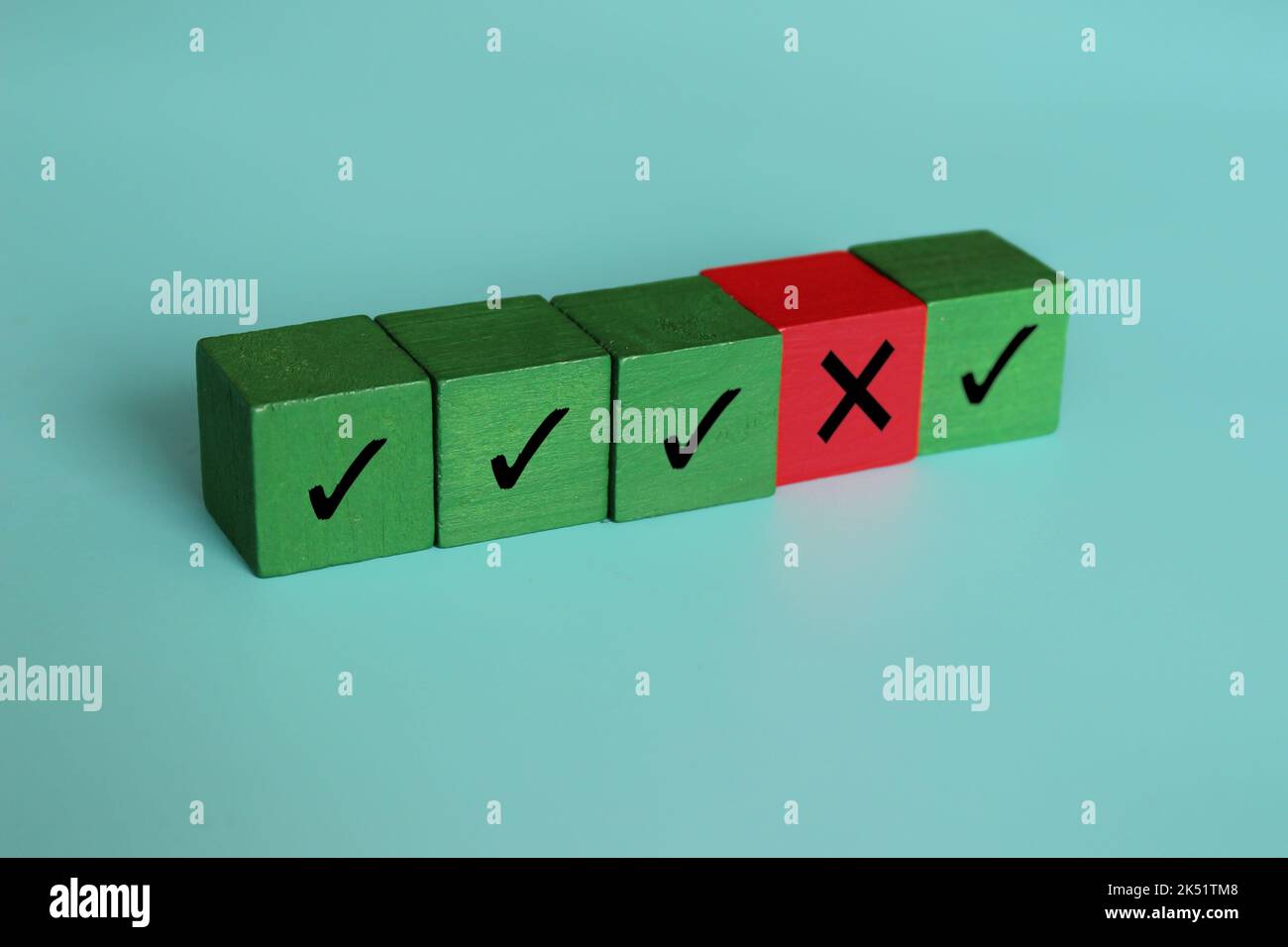 Wooden cubes with right and wrong icon. Violation contract terms ...