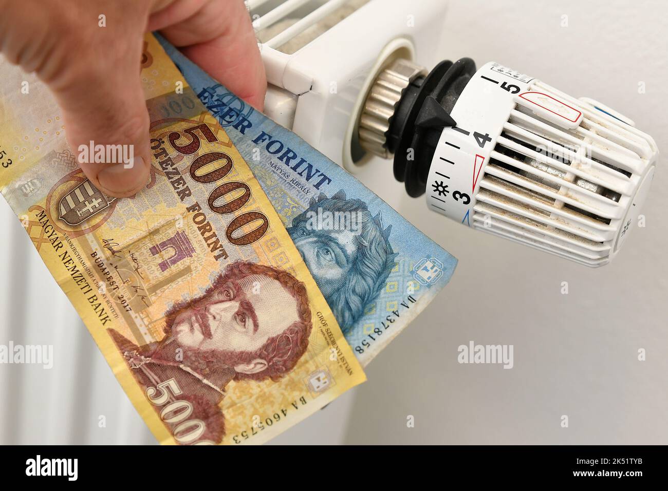 Illustration photo - a thermostat on a modern heating system in an ...