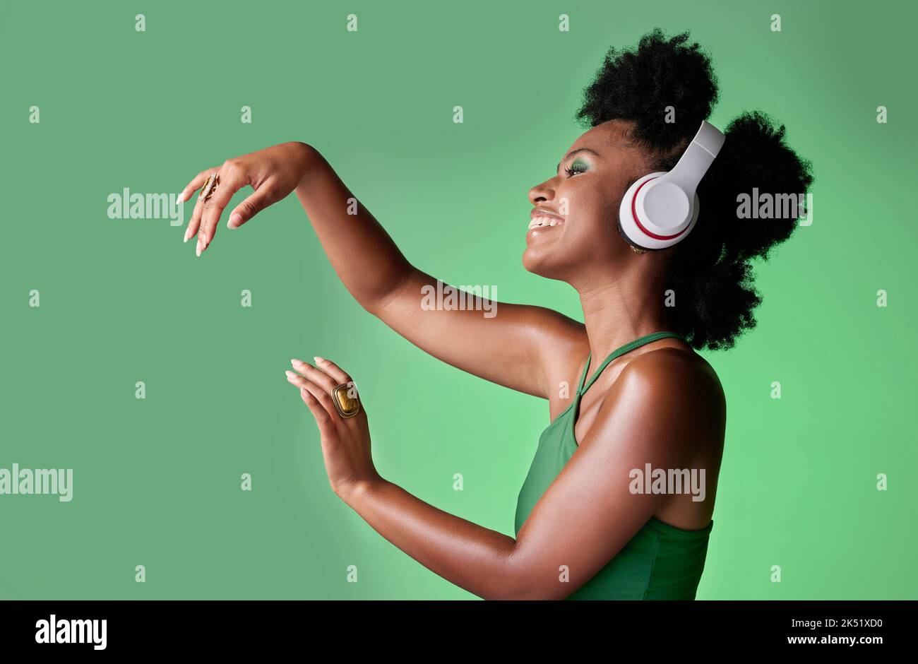 Dance, studio and black woman dancing to music in headphones while ...