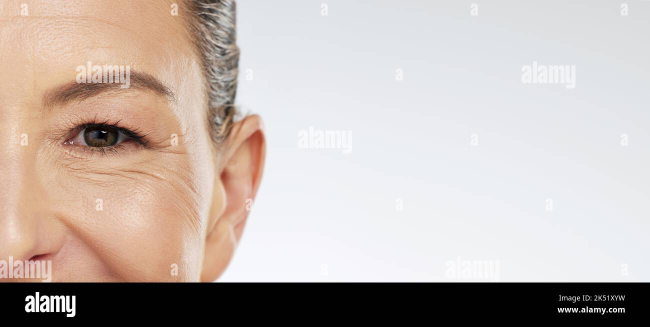 Half face portrait, skincare and mature woman with beauty treatment ...