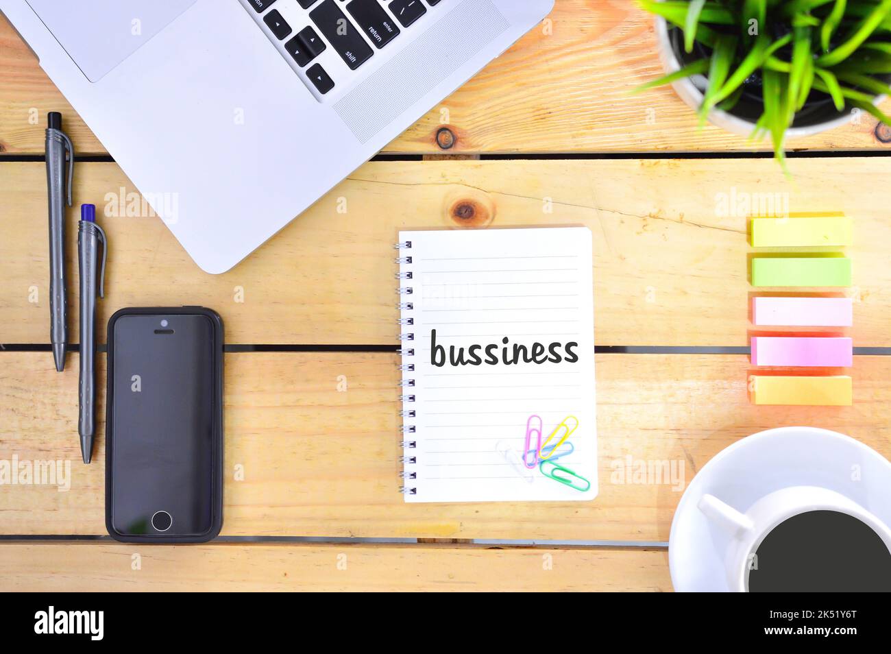 Top view notepad with to-do list, agenda, paper with business on wooden ...