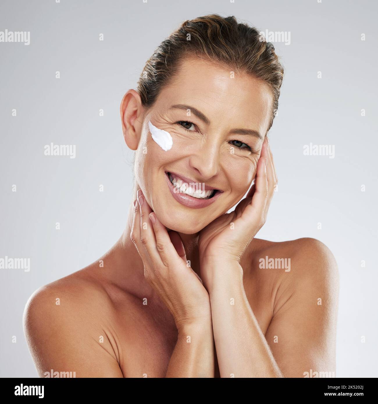 Beauty, face cream and skincare by elderly woman grooming hygiene ...