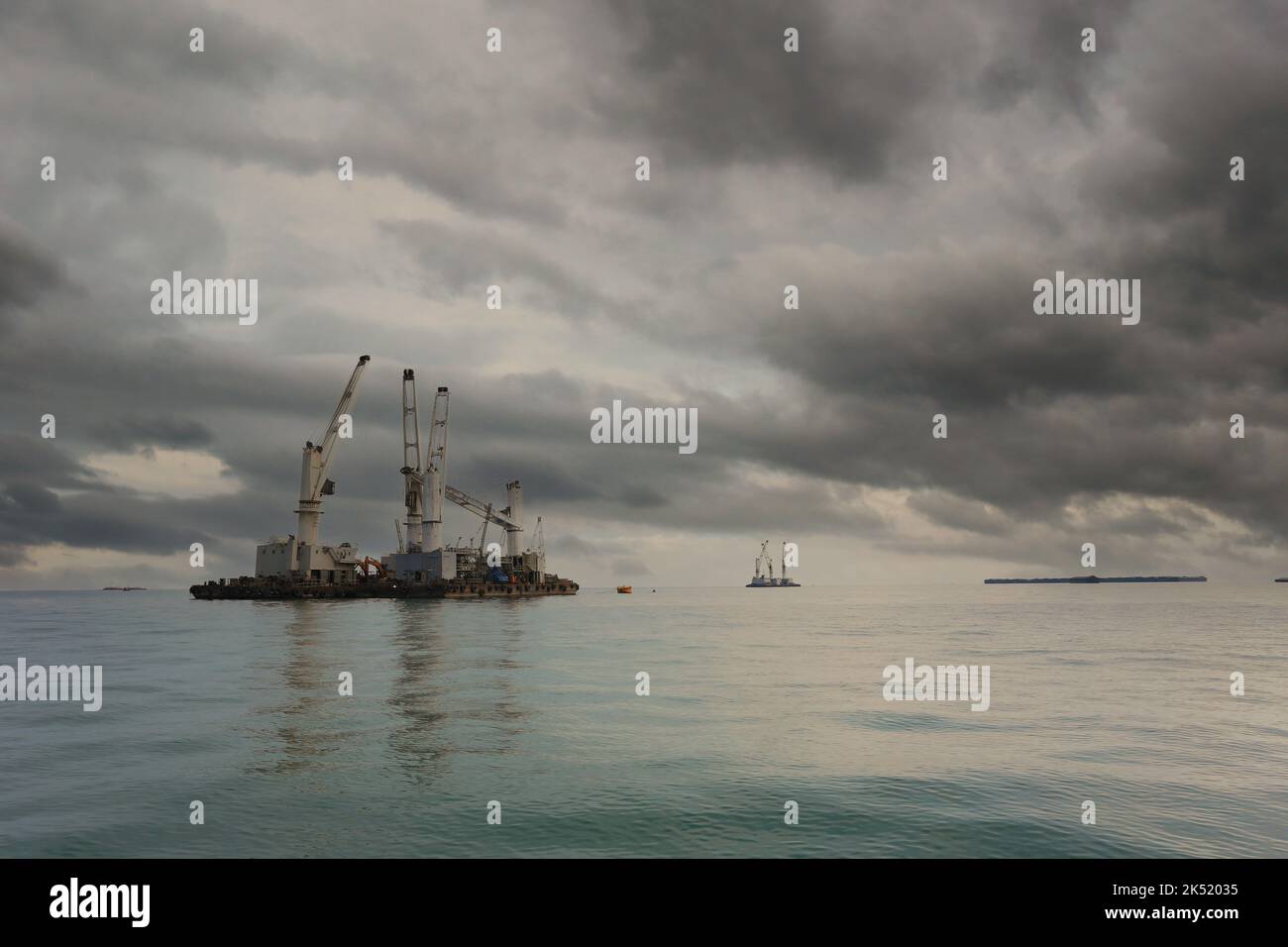 Marine cranes are used for loading and unloading cargo onto ships, The ...