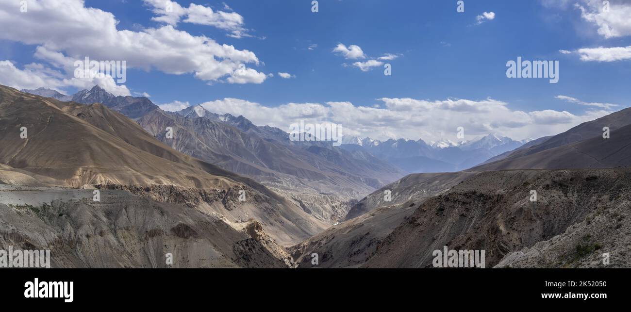 Panoramic view of high altitude Pamir river valley with snow capped ...