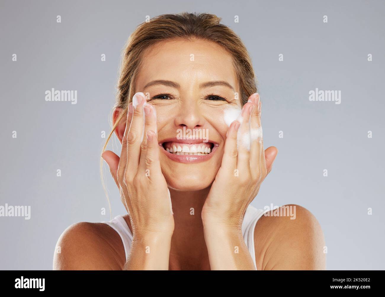 Skincare, clean and face portrait of a woman washing her skin with ...