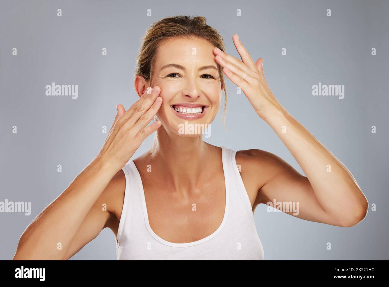Skincare, beauty and woman with face portrait in studio grey background ...