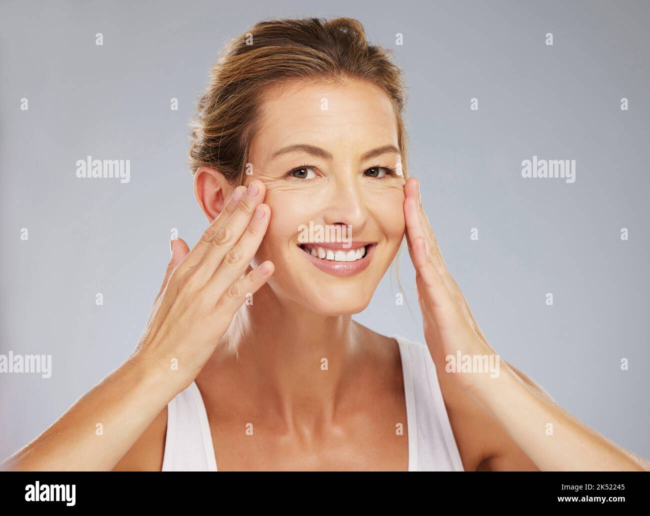 Face wellness, skincare and mature woman with smile for healthy ...