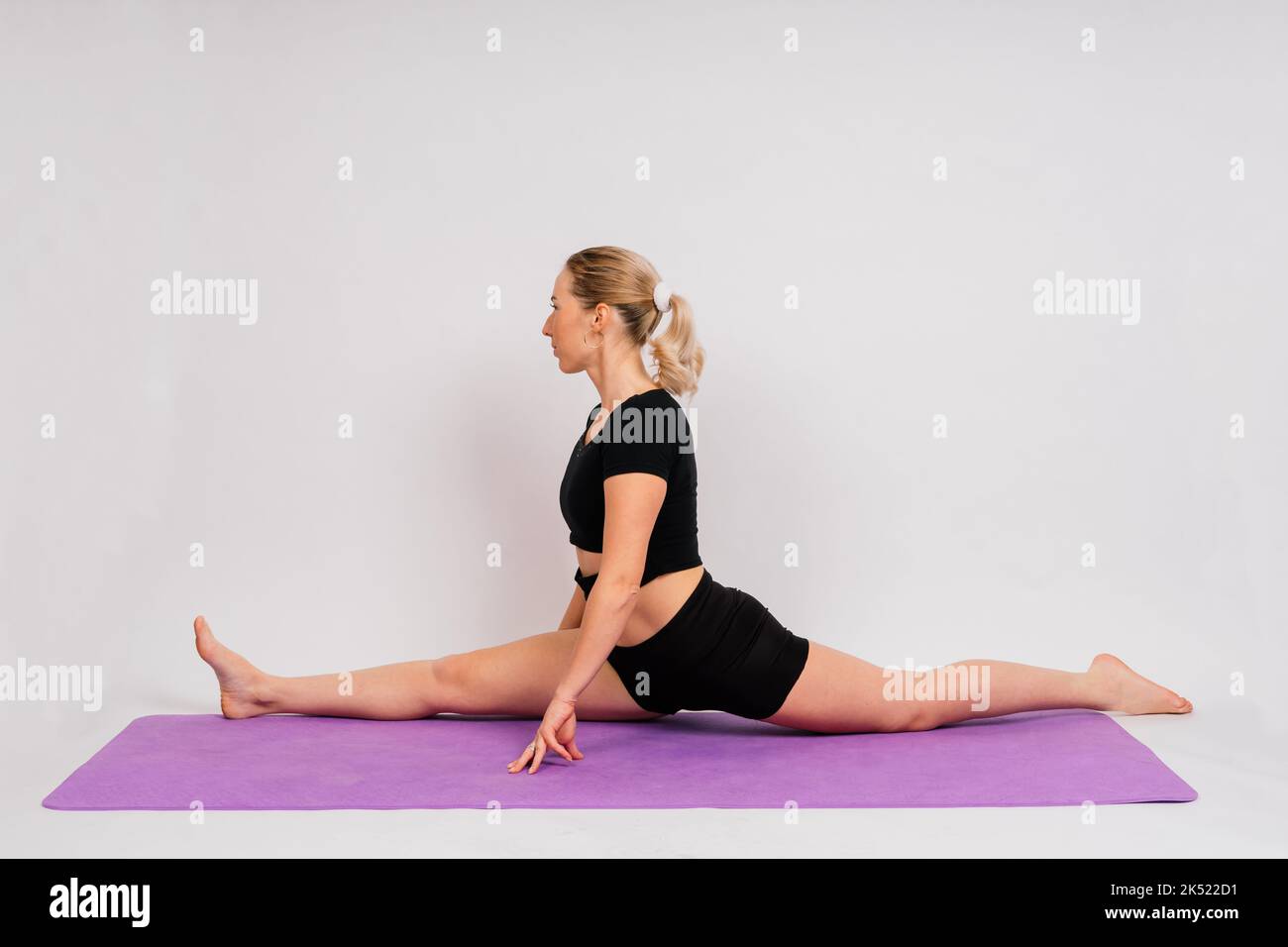 Sporty girl doing exercise with dumbbells, silhouette studio shot over ...