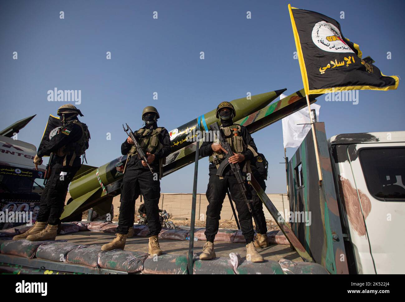 Armed masked fighters of Al-Quds Brigades, the military wing of Islamic ...