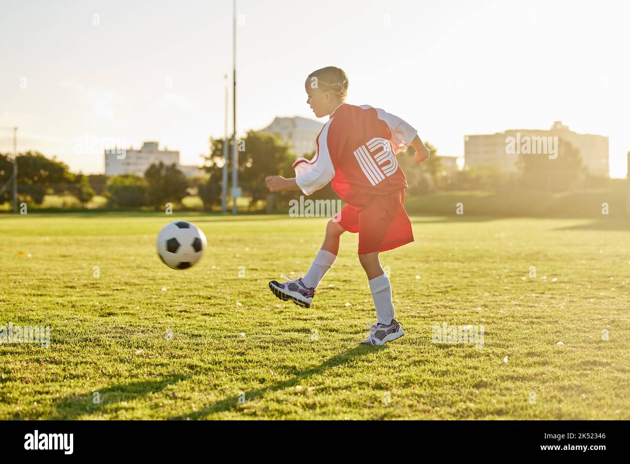 Fitness, sport girl and soccer with football running, kick or exercise ...