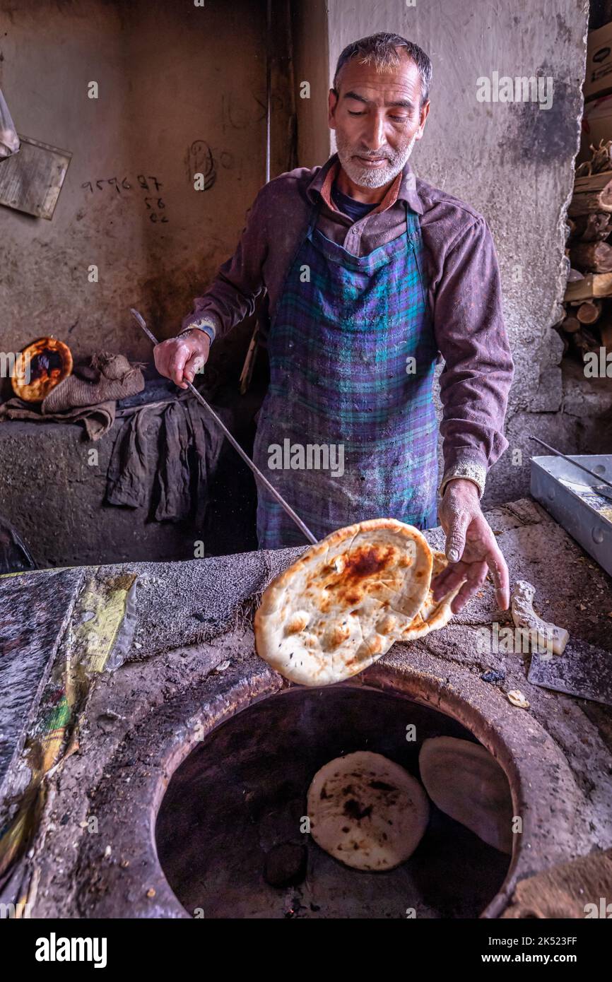 A man baking bread in Leh, Ladakh, India Stock Photo - Alamy
