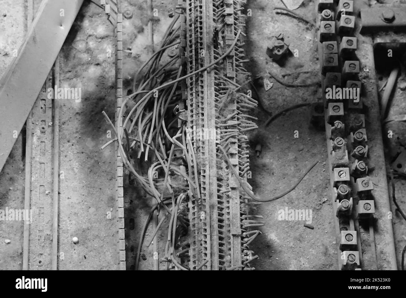 A grayscale shot of dirty, old, and dusty electrical networking wires ...