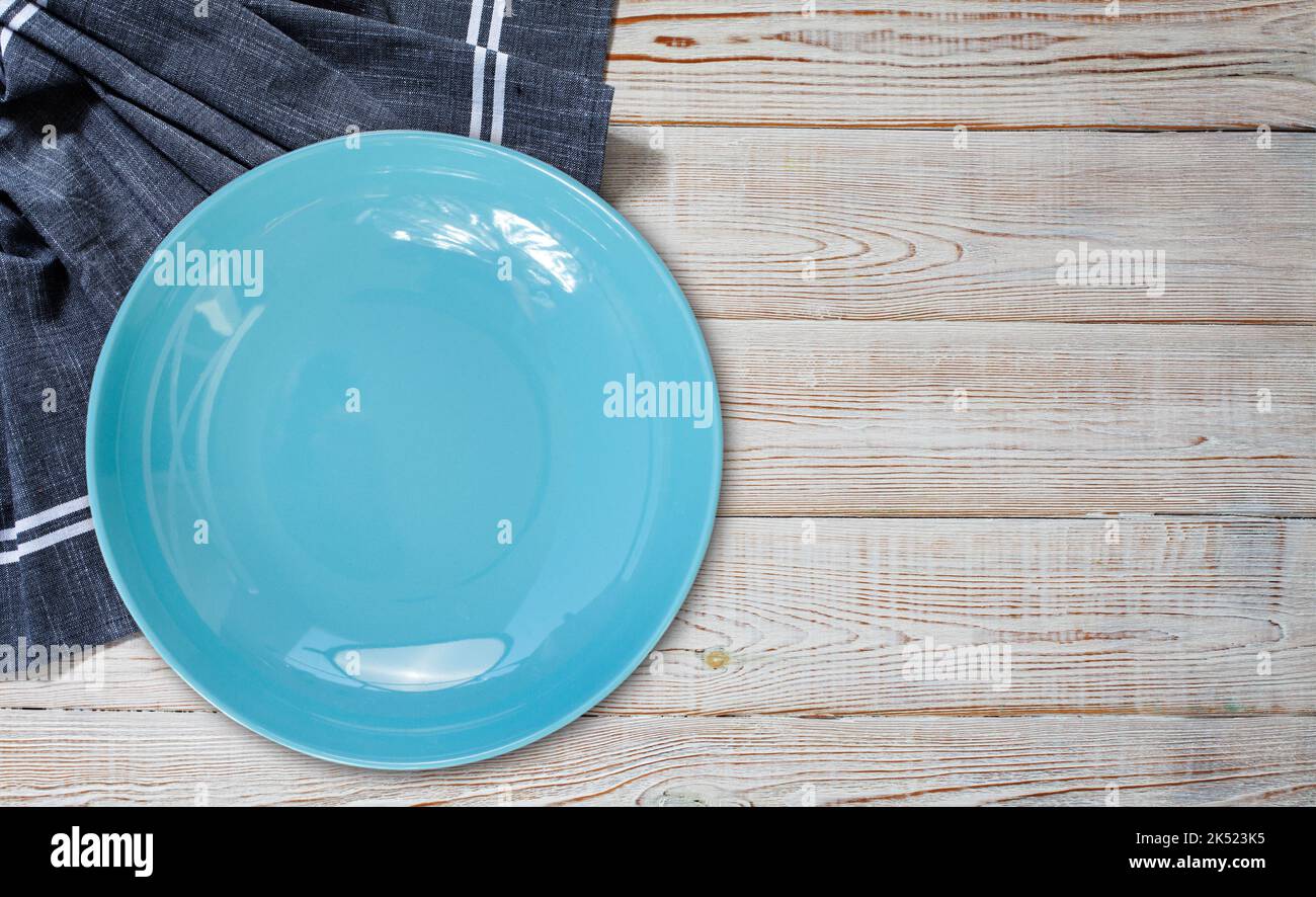 Empty blue plate and tablecloth on wooden table, flat lay top Stock ...